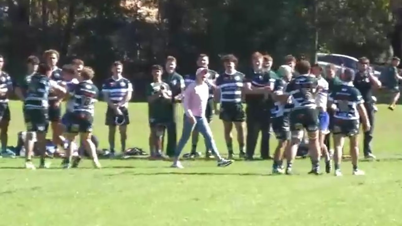 Mum sanctioned after storming onto rugby field to defend her son ...